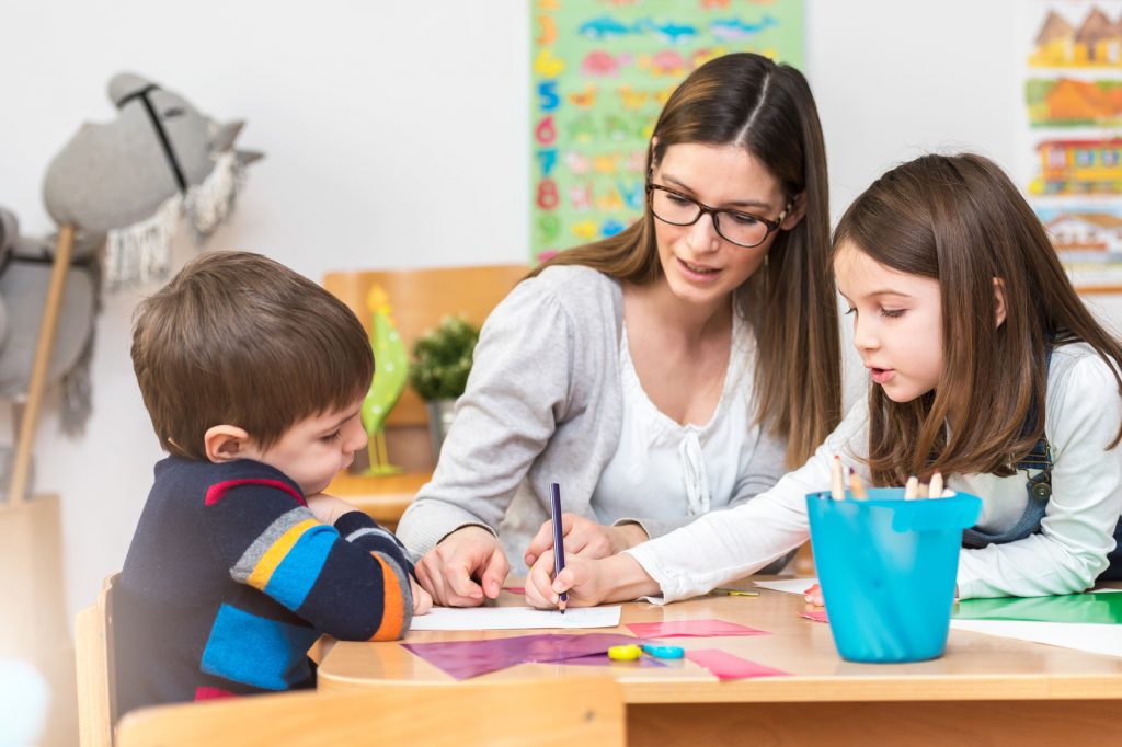 Teacher Working with Children in Preschool Classroom — The James G ...
