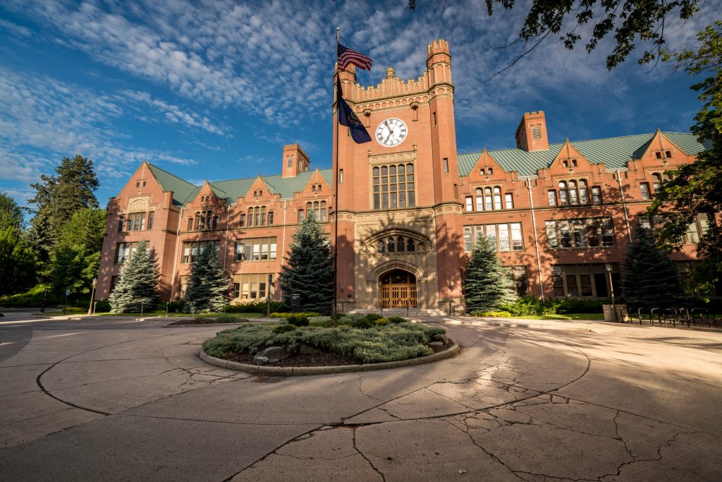 A university Administration building with flag — The James G. Martin ...