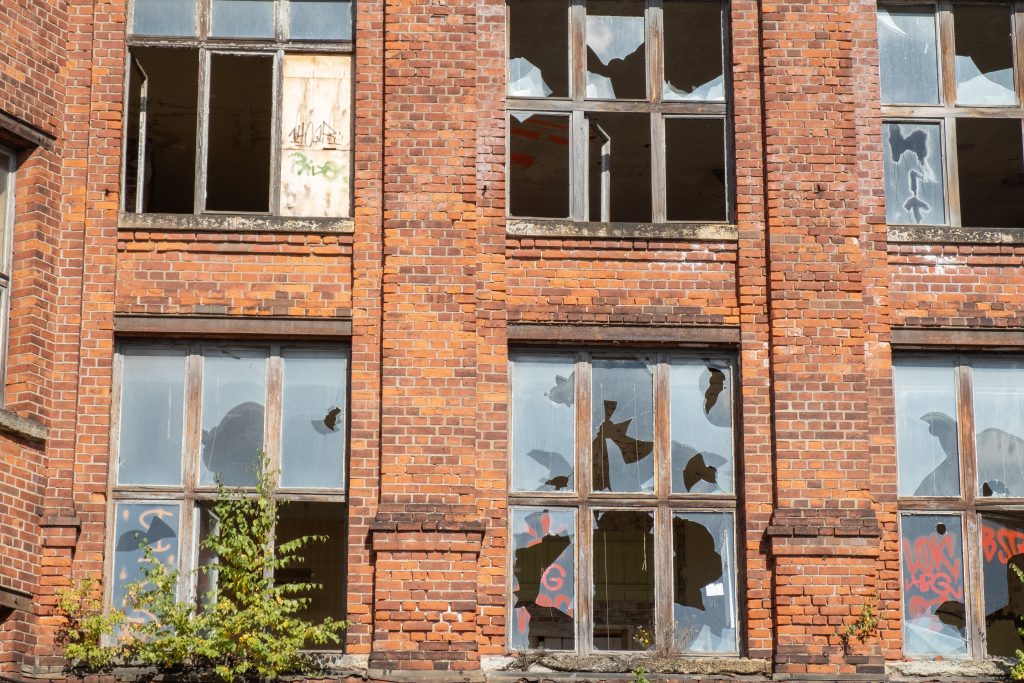an old condemned house with broken windows — The James G. Martin Center ...